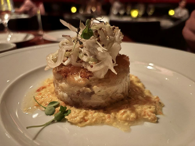 A crab cake tower that stands tall and proud, showcasing the ocean's sweetest treasures within.