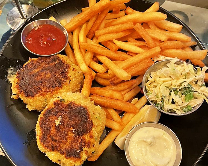 Crab cakes that are actually crab, not breadcrumbs with a seafood rumor. Paired with fries that understand their supporting role perfectly.