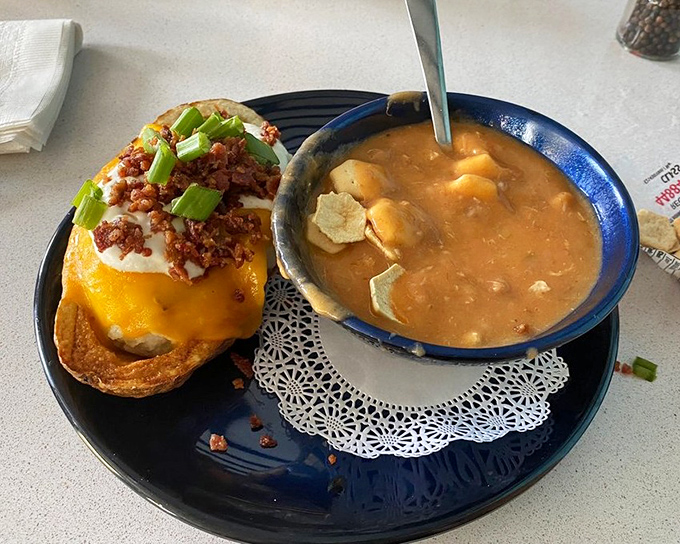The dynamic duo of comfort: hearty crab soup alongside a loaded baked potato. It's like the culinary equivalent of your favorite buddy comedy.