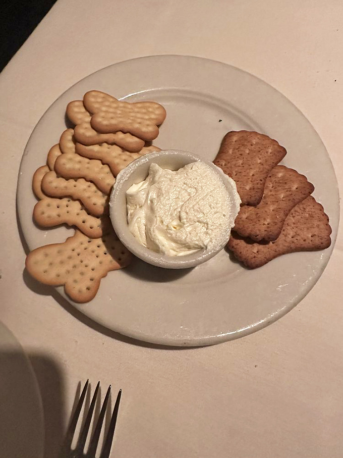 The unsung hero of fine dining: house-made spread with crackers. The appetizer before the appetizer that sets the tone.