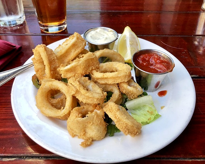 Crispy calamari that shatters with each bite, served with dipping sauces that make you wonder why you'd ever share this starter.