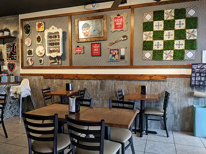 Wall art that tells stories while you eat. The eclectic decor creates an atmosphere that's part gallery, part comfort zone, all charm.