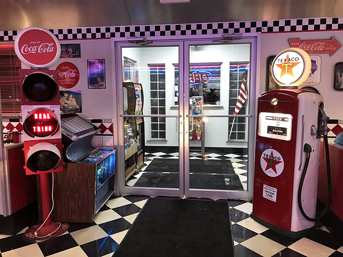 Pink neon casts a nostalgic glow across the dining room, where conversations flow as freely as the coffee.