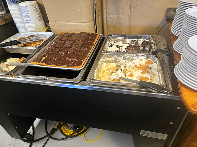 The dessert station: where diets go to die happy. That chocolate sheet cake has witnessed countless "just one small piece" promises.