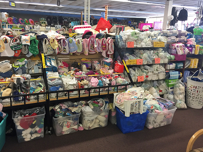 Baby essentials organized with military precision&mdash;proof that tiny humans require more gear than most adults accumulate in a lifetime.