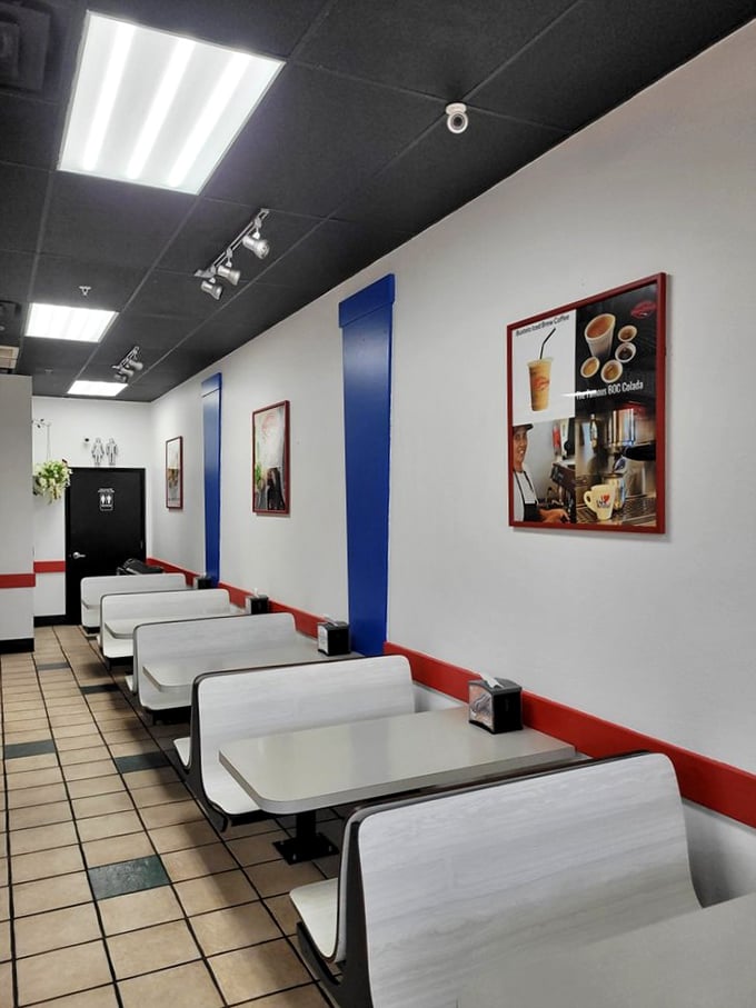 The dining area keeps it simple with booth seating and patriotic color scheme. No distractions from the main event happening on your plate.