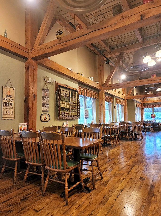 Exposed wooden beams and farmhouse charm create a dining atmosphere that feels like you've stepped into a cozy country kitchen.