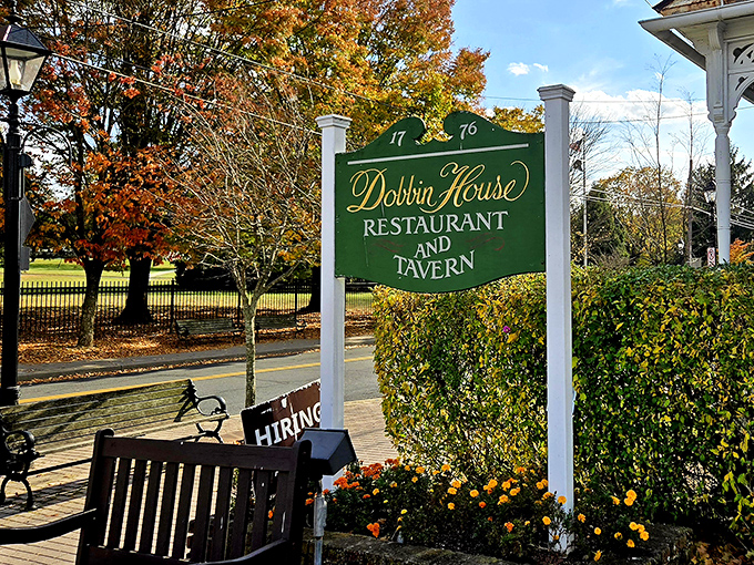 The Dobbin House Tavern sign beckons visitors to experience dining where colonial charm meets modern hospitality perfectly.