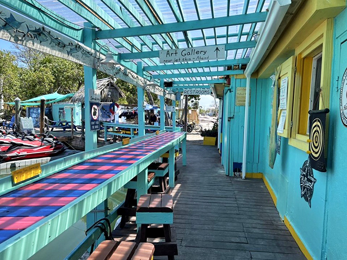 Turquoise walkways and cheerful yellow accents lead to what might be the most relaxing dining experience in the Keys. Art gallery meets seafood paradise.