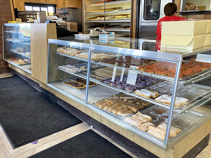The display case of dreams where every donut variety beckons like old friends welcoming you home.