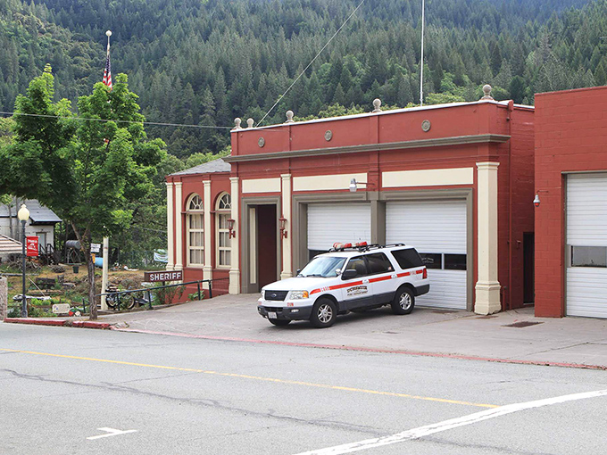 Dunsmuir's fire station stands ready in its classic red brick glory. Small town safety with big architectural character.