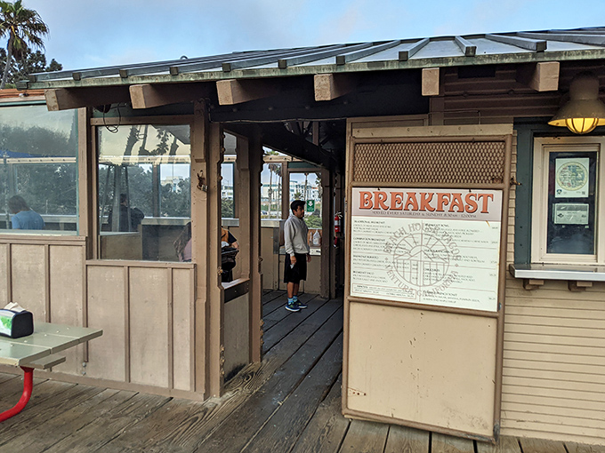 The entrance to taco paradise isn't pearly gates—it's weathered wood planks with a breakfast menu that makes angels sing.