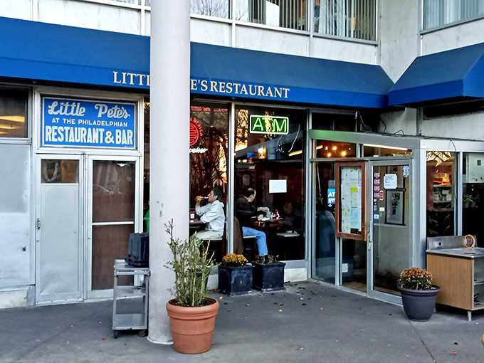 The entrance to Little Pete's doesn't just open to a restaurant—it's a portal to the Philadelphia experience, complete with ATM for emergency cheesesteak funds.