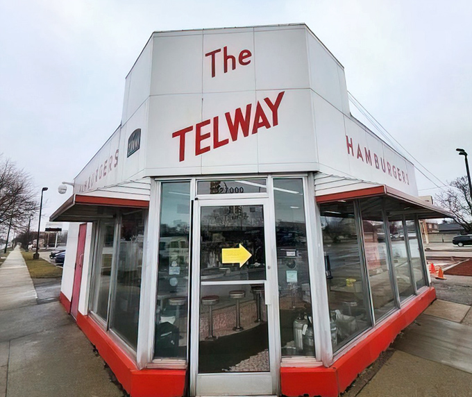 The corner entrance beckons with its mid-century charm. That yellow arrow isn't pointing to the door—it's pointing to your happiness.