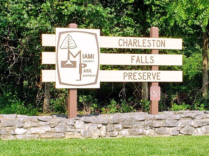 The official welcome sign: your invitation to temporarily trade spreadsheets and Zoom calls for waterfalls and birdsong.