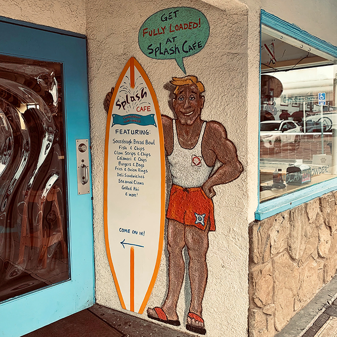 The entrance mural features a surfer who clearly knows where to find the best post-wave meal.