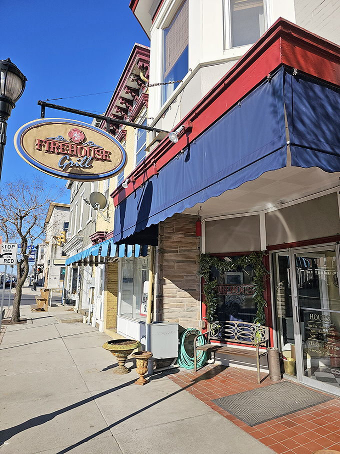 The Firehouse Grill's inviting storefront promises comfort food that fights hunger with the same dedication firefighters battle blazes.