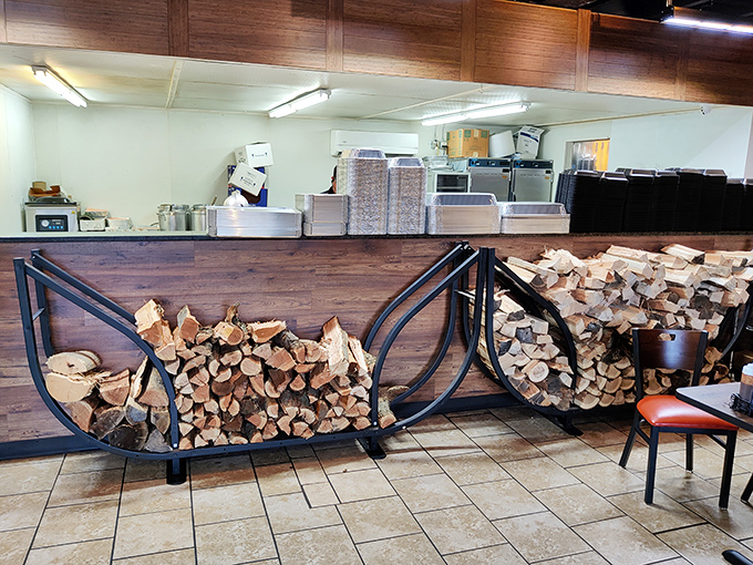 Stacked firewood isn't just decoration&mdash;it's a promise. Each log represents hours of slow-smoking magic that transforms ordinary meat into extraordinary memories.