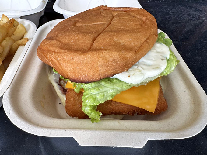 The fish sandwich: proof that seafood doesn't need white tablecloths to shine. That golden-fried fillet practically high-fives your taste buds.