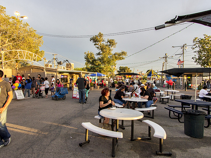 The food court serves as the swap meet's town square, where strangers become temporary neighbors over shared meals and desert breezes.