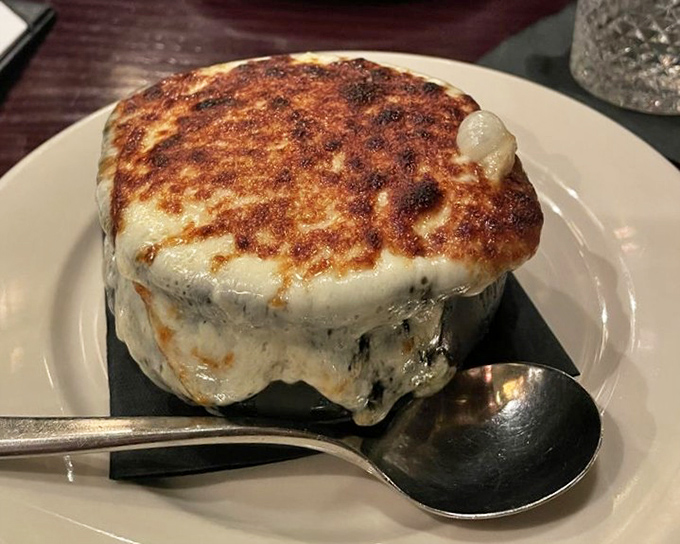 French onion soup with a cheese cap so perfectly browned, it deserves its own standing ovation and acceptance speech.