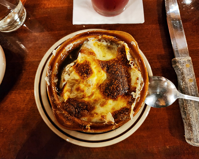 French onion soup bubbles under a blanket of bronzed cheese&mdash;a timeless appetizer that's worth the inevitable string of cheese stretching from bowl to mouth.