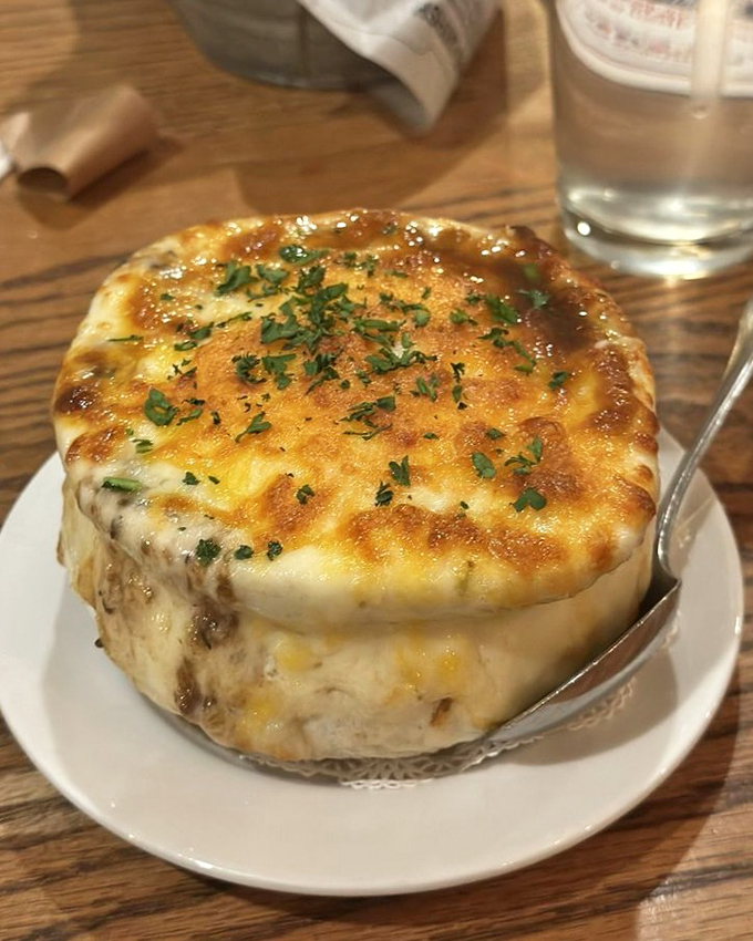 This isn't just French onion soup; it's a cheese-crowned masterpiece that makes you understand why people write songs about food. 