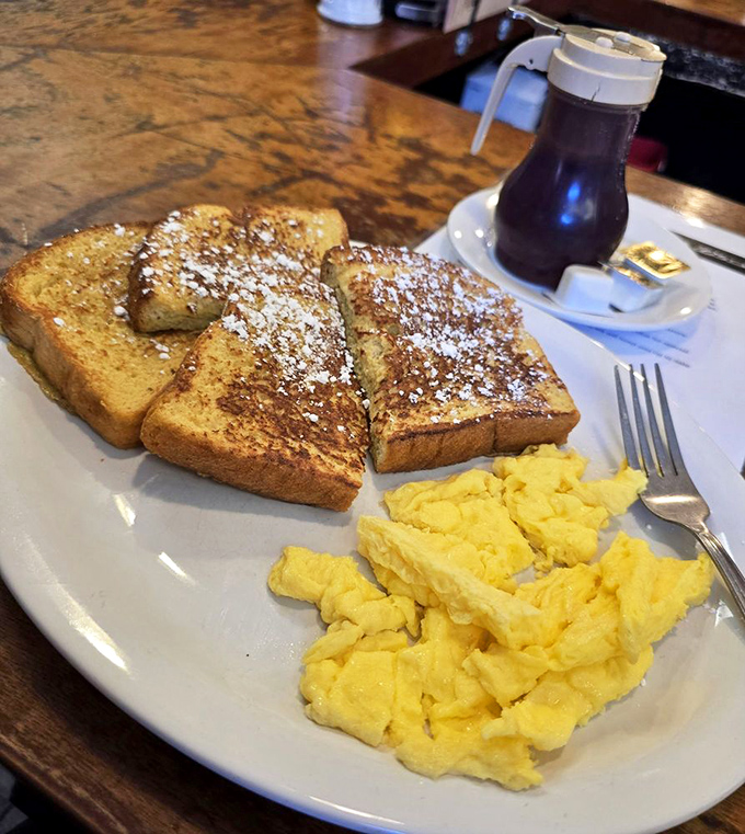French toast that's dressed for success with powdered sugar and a side of eggs that brighten the plate like edible sunshine.