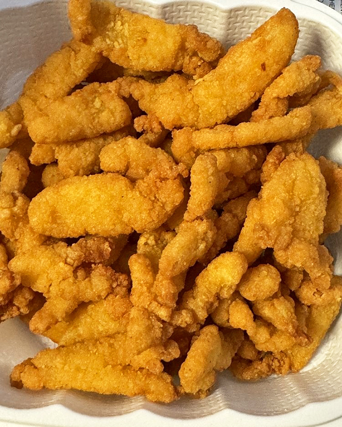 These golden-fried clam pieces aren't just food&mdash;they're little nuggets of oceanic joy. Crispy outside, tender inside, happiness throughout.