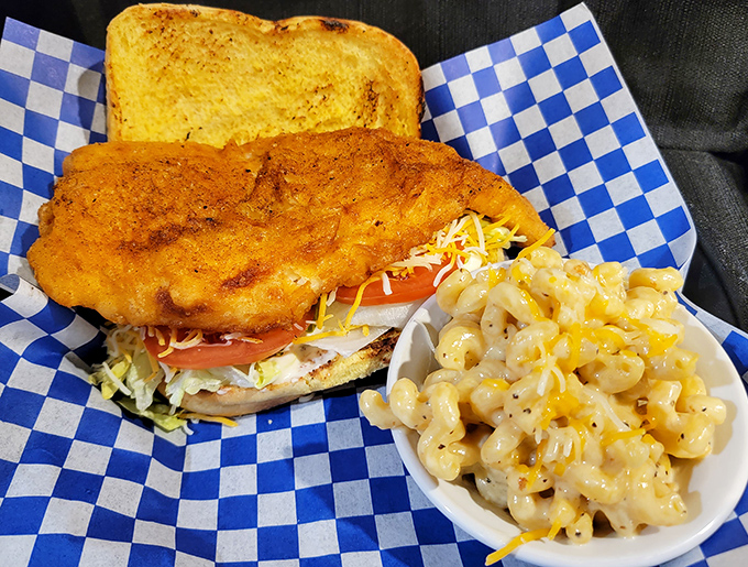 A fish sandwich that doesn't play second fiddle to the barbecue&mdash;it demands respect with golden breading and a side of mac that's pure comfort.