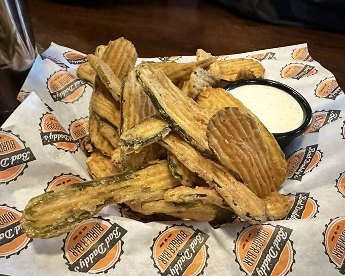 Fried pickles: where tangy meets crunchy in a dance of contrasts. These addictive discs disappear faster than your resolution to eat sensibly.