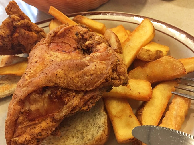 Fried chicken that makes you want to write poetry about its golden, crispy exterior. Those fries aren't sidekicks—they're co-stars in this delicious drama.