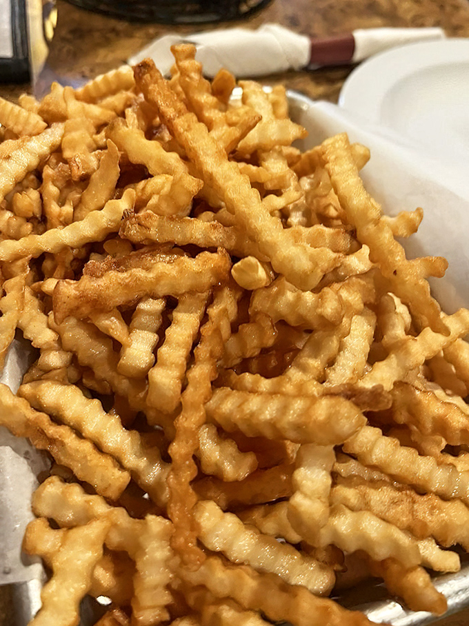 Crinkle-cut fries that look like they're wearing corduroy pants. Crispy on the outside, fluffy inside&mdash;the mullet haircut of side dishes.