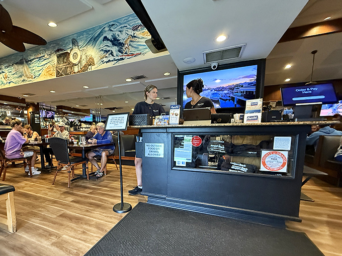 The heart of operations &ndash; where orders are called, coffee is poured, and the rhythm of a well-loved restaurant plays out all day long.