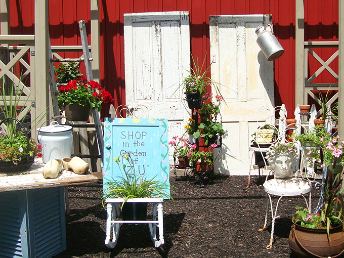 "Shop in the Garden" isn't just a sign&mdash;it's an invitation to discover treasures among the blooms. Even the chairs have stories to tell.