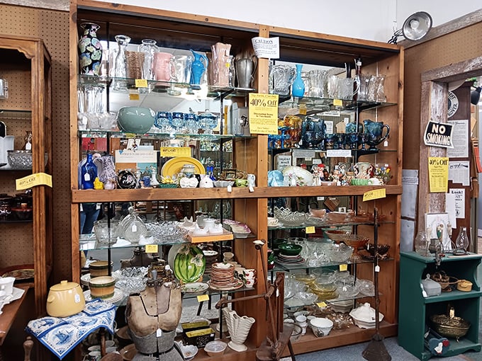 Crystal, depression glass, and vintage dishware sparkle under the lights, each piece whispering stories of Sunday dinners from decades past.