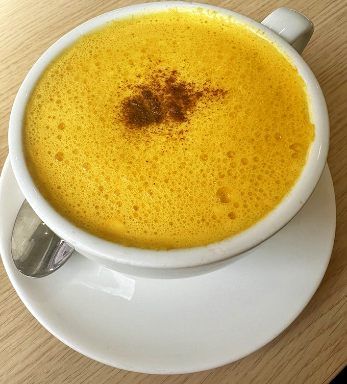 Golden milk latte that looks like liquid optimism. The kind of drink that makes you believe everything's going to be alright today.