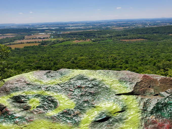 The rocks tell stories in spray paint &ndash; part vandalism, part community bulletin board, completely charming.