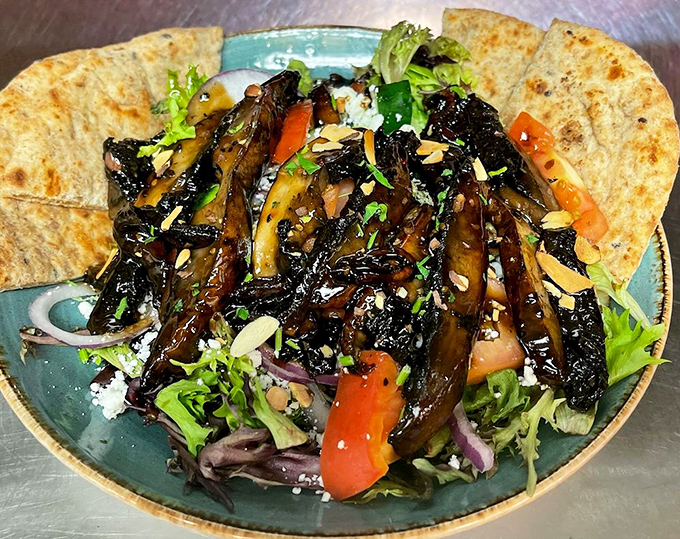 Grilled portobello salad elevates vegetables to gourmet status with every perfectly balanced, colorful bite.