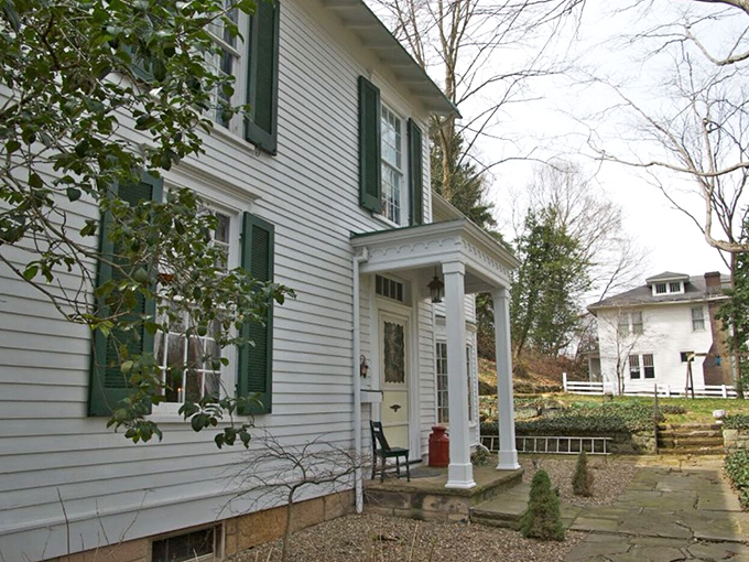 The Holly Hill Inn's classic white clapboard and green shutters whisper stories of hospitality that stretch back through generations of Ohio history.