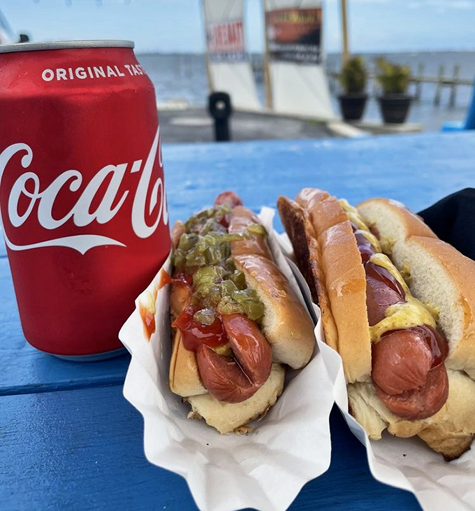 Two perfectly dressed hot dogs with a Coca-Cola &ndash; sometimes simple perfection needs no explanation whatsoever.