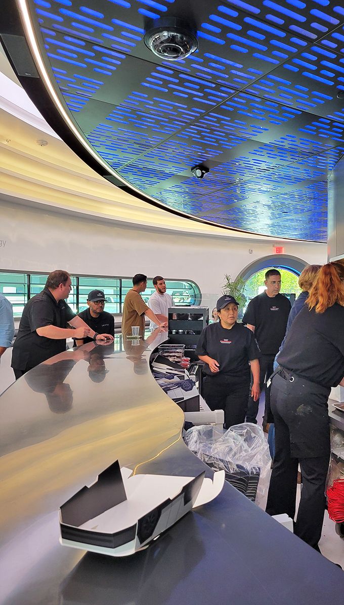 The blue ceiling lighting creates an atmosphere that's part upscale diner, part "beam me up with a burger" sci-fi experience. 