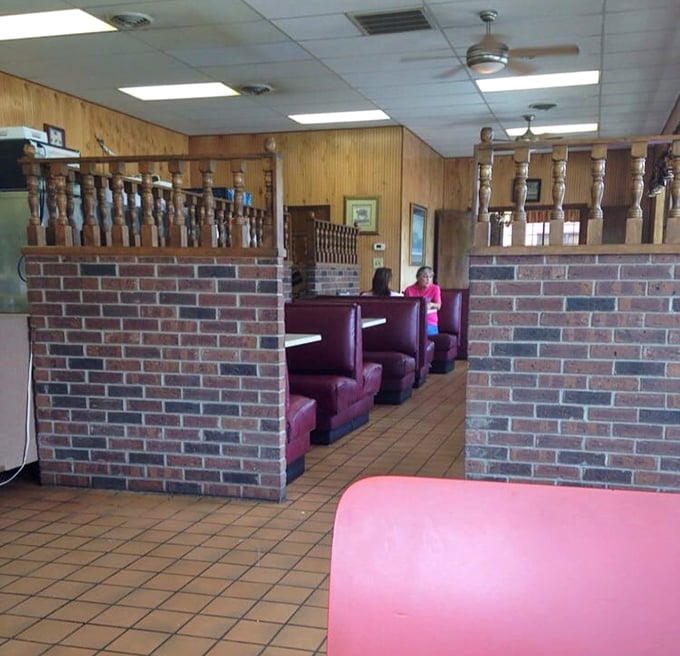 Dividers that create the illusion of privacy while maintaining the communal spirit. The worn brick and wood tell stories that no newly designed space could match.