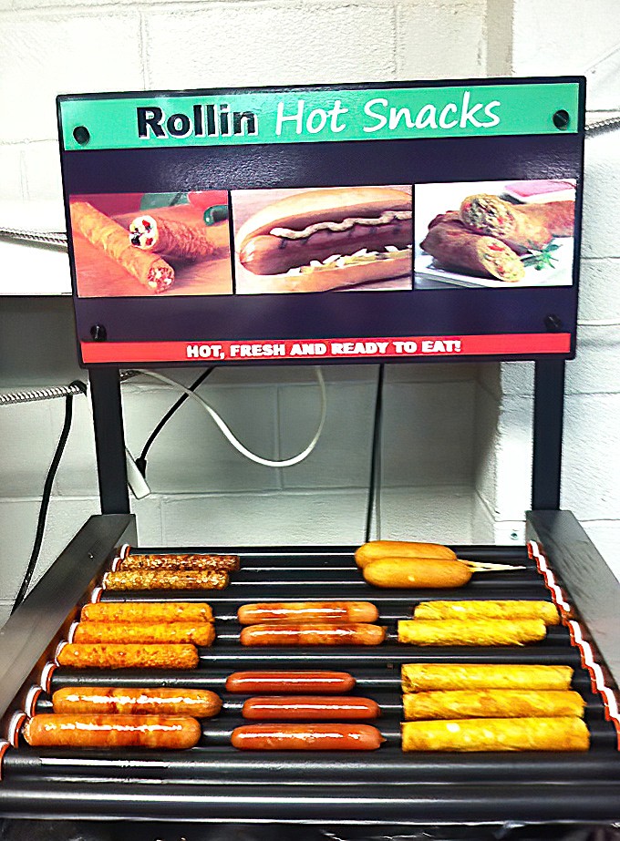 The hot dog station sizzles with promise, creating those perfect Coney masterpieces you've been craving.