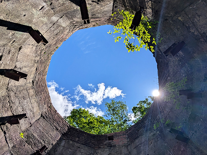 Looking up through history's chimney to today's blue sky. This limestone kiln interior frames the heavens like a portal to simpler times.