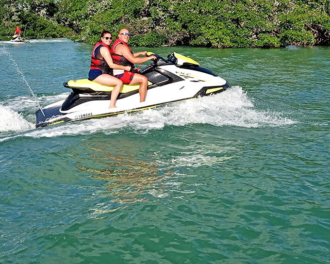 Jet skis carve aquamarine pathways through mangrove tunnels—nature's rollercoaster without the long lines or height requirements.