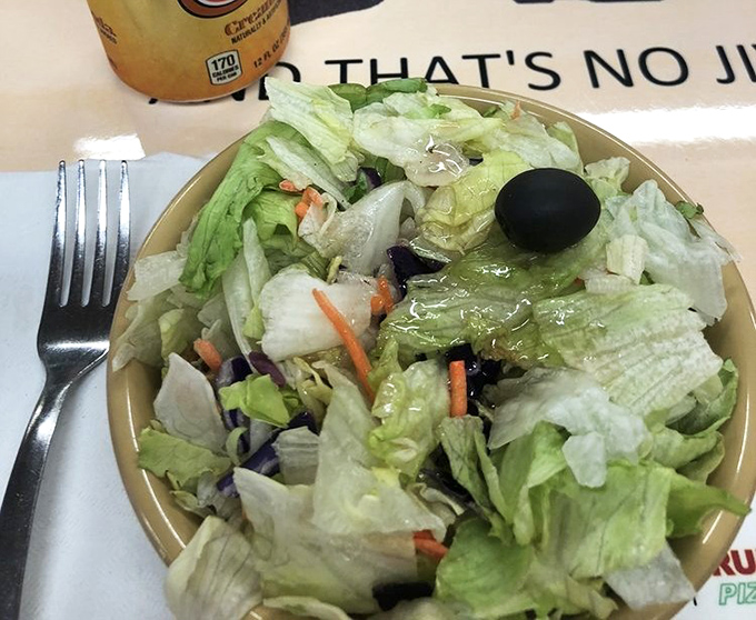This Italian salad isn't trying to win any beauty contests, but that black olive is the exclamation point on a simple statement of freshness.