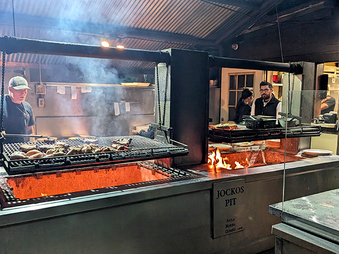 Where the magic happens: Jocko's legendary pit, where meat meets fire in a dance as old as time. That smoke isn't pollution—it's perfume.