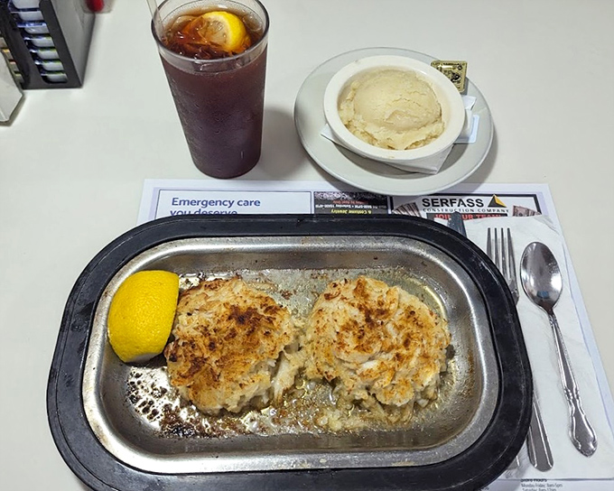 Crab cakes that actually taste like crab &ndash; served with a lemon wedge that's not just garnish but a necessary brightening counterpoint to the richness.