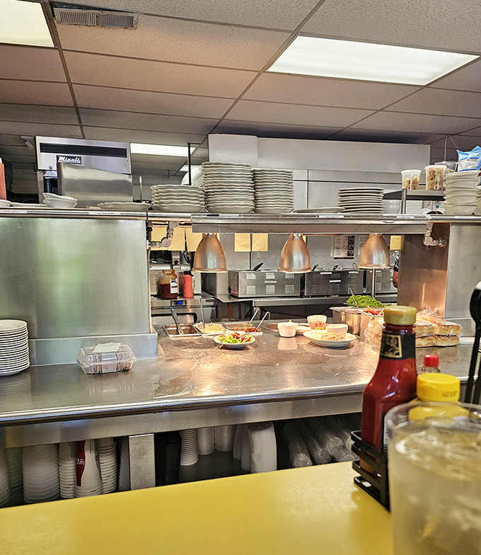 Behind the scenes where the magic happens&mdash;stacks of plates waiting for their moment to shine as vessels for homestyle goodness.
